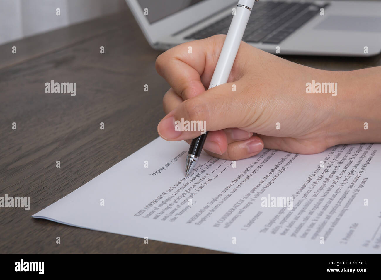 Close up of hand completing an employment application form Stock Photo ...