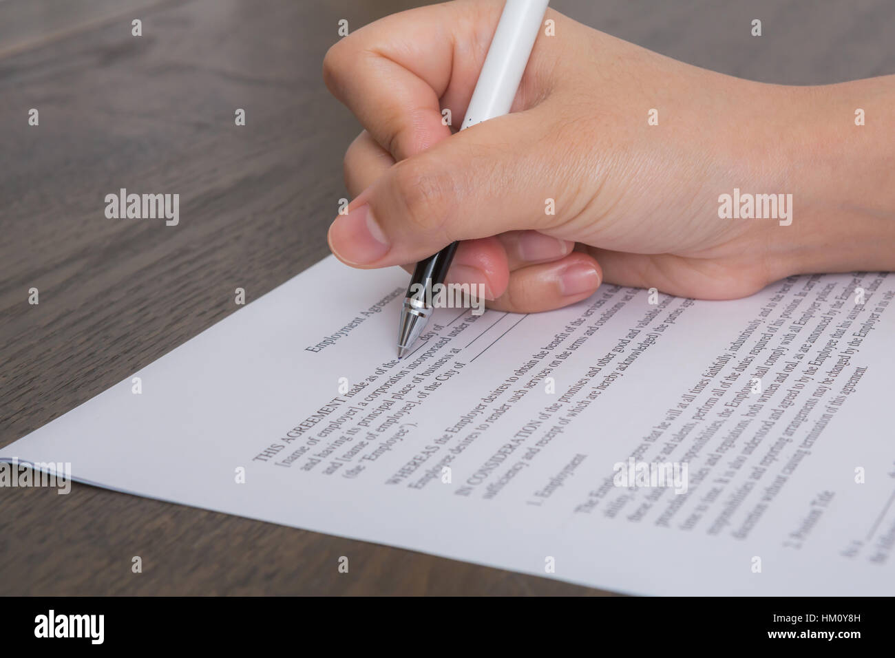Close up of hand completing an employment application form Stock Photo ...