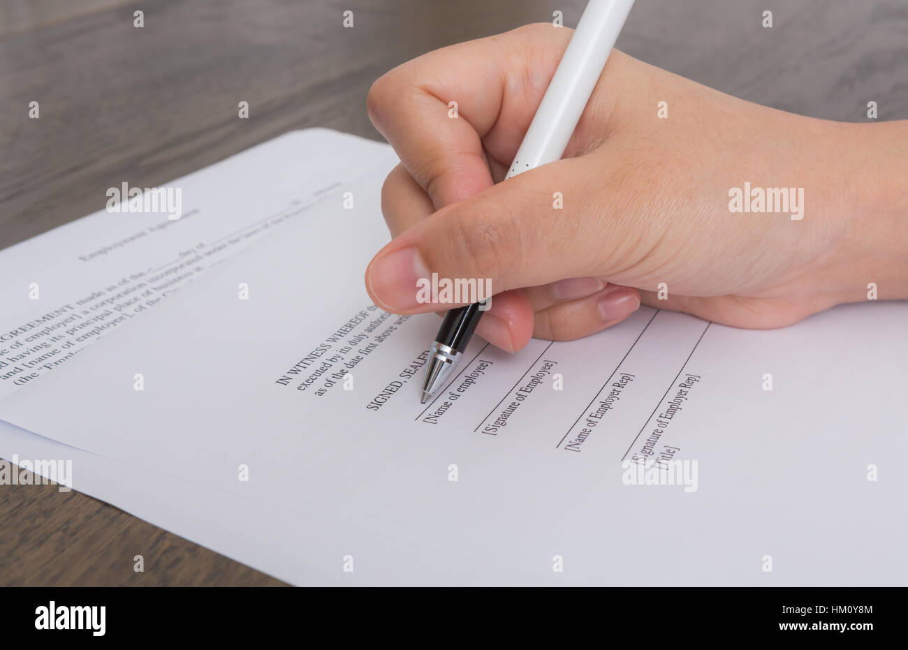 Close up of hand completing an employment application form Stock Photo ...