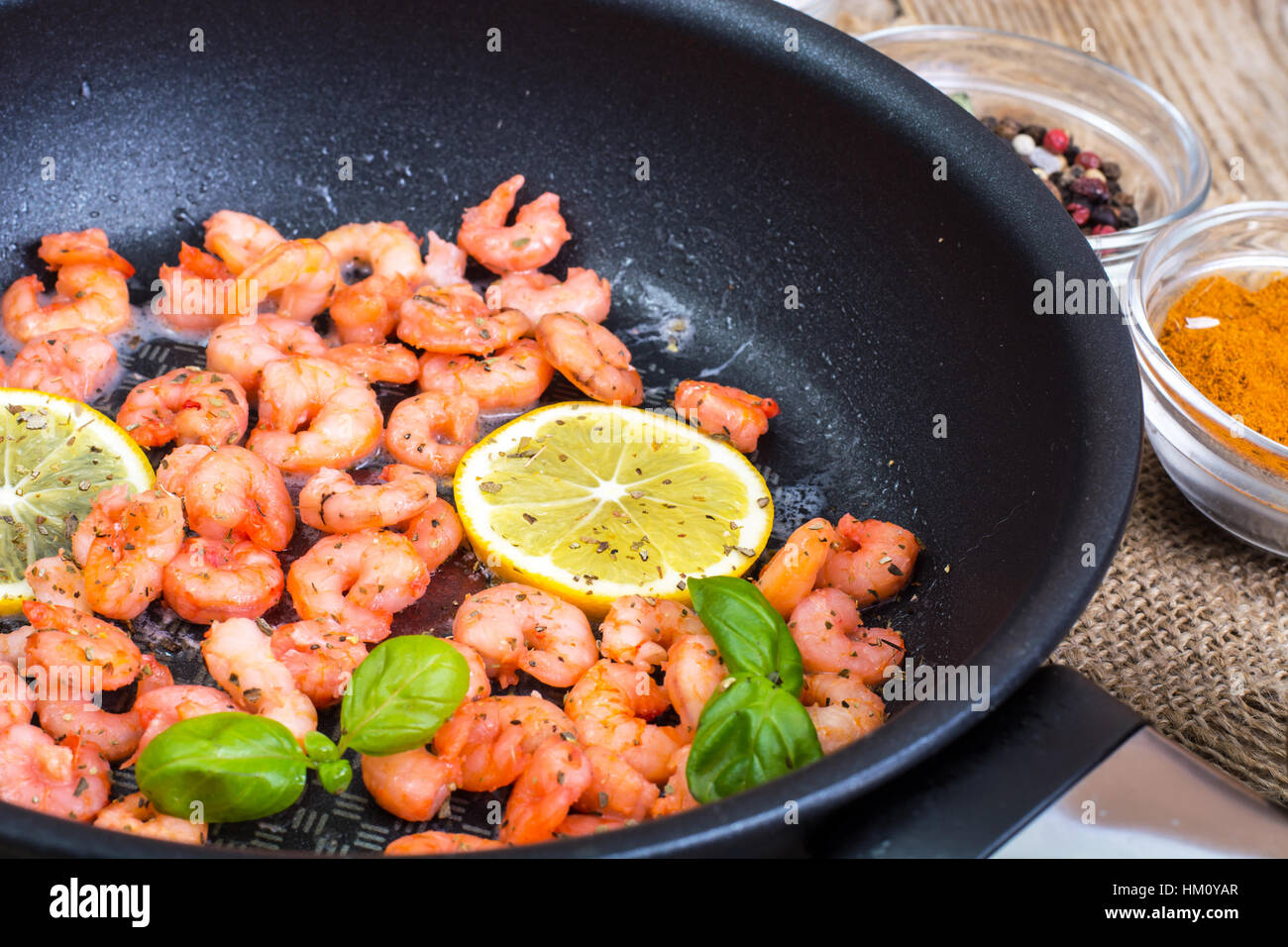 Small shrimp with lemon in a frying pan Stock Photo - Alamy