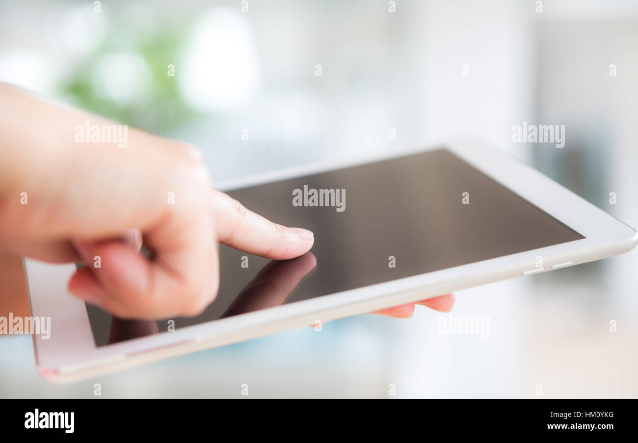 Woman hand hold white tablet with blank empty screen Stock Photo - Alamy