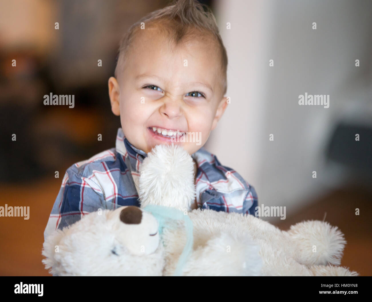 Young toddler boy cuddling with a teddy bear Stock Photo - Alamy
