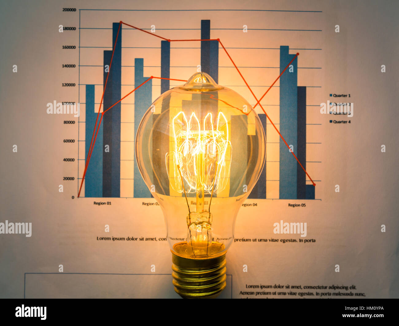 Light bulb with business graph Stock Photo - Alamy