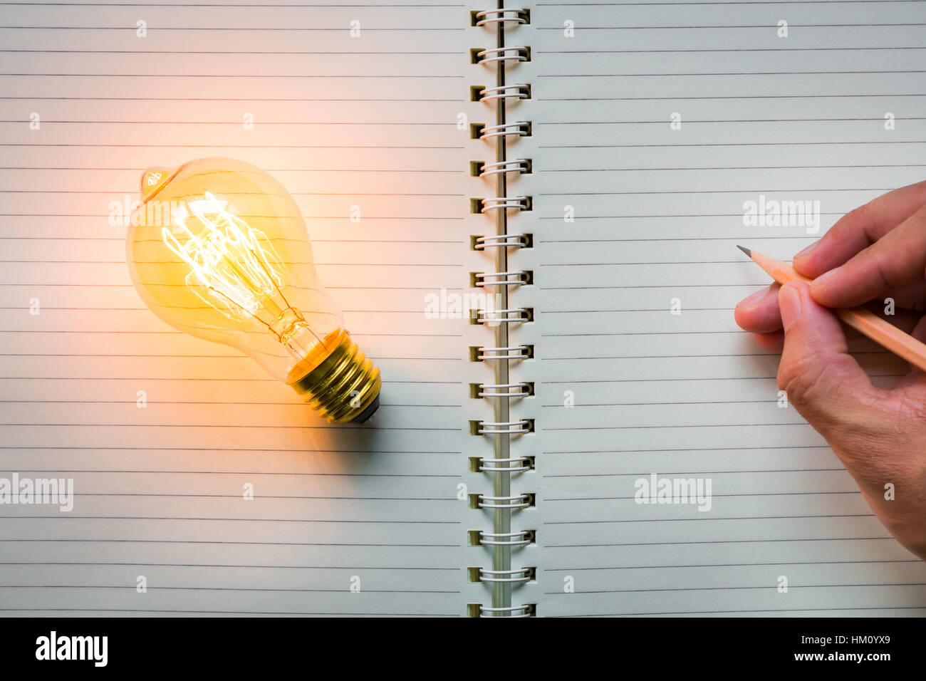Hand write over Note book and light bulb Stock Photo - Alamy