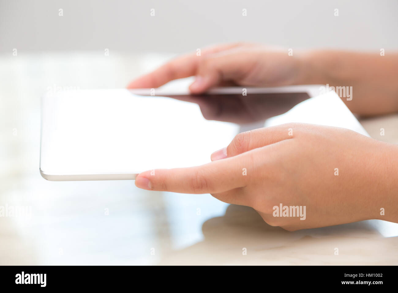 Woman hand touch white tablet with blank empty screen Stock Photo - Alamy