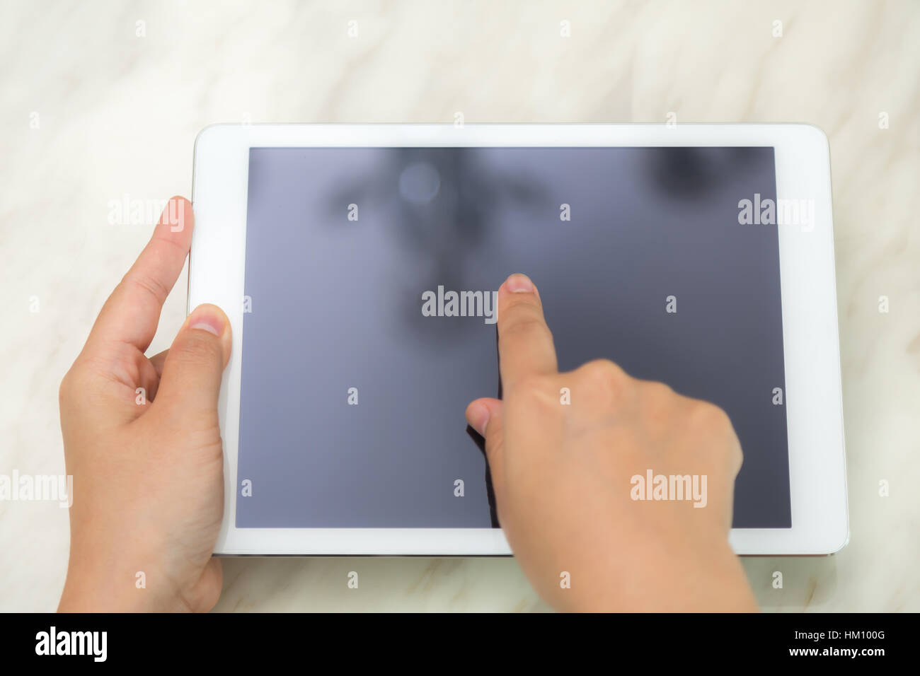 Woman hand touch white tablet with blank empty screen Stock Photo - Alamy