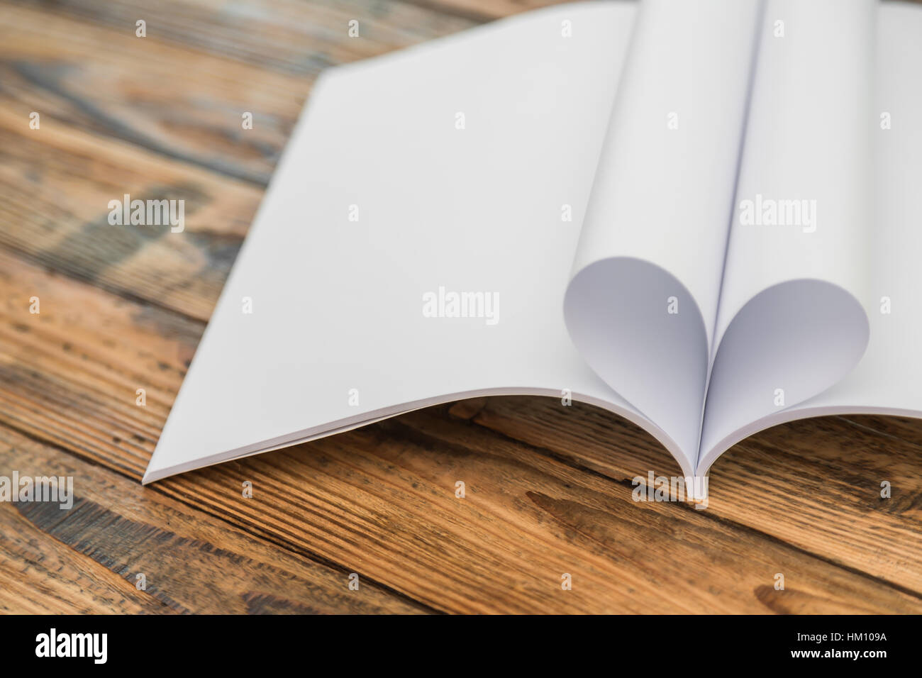 Book with opened pages of shape of heart Stock Photo - Alamy