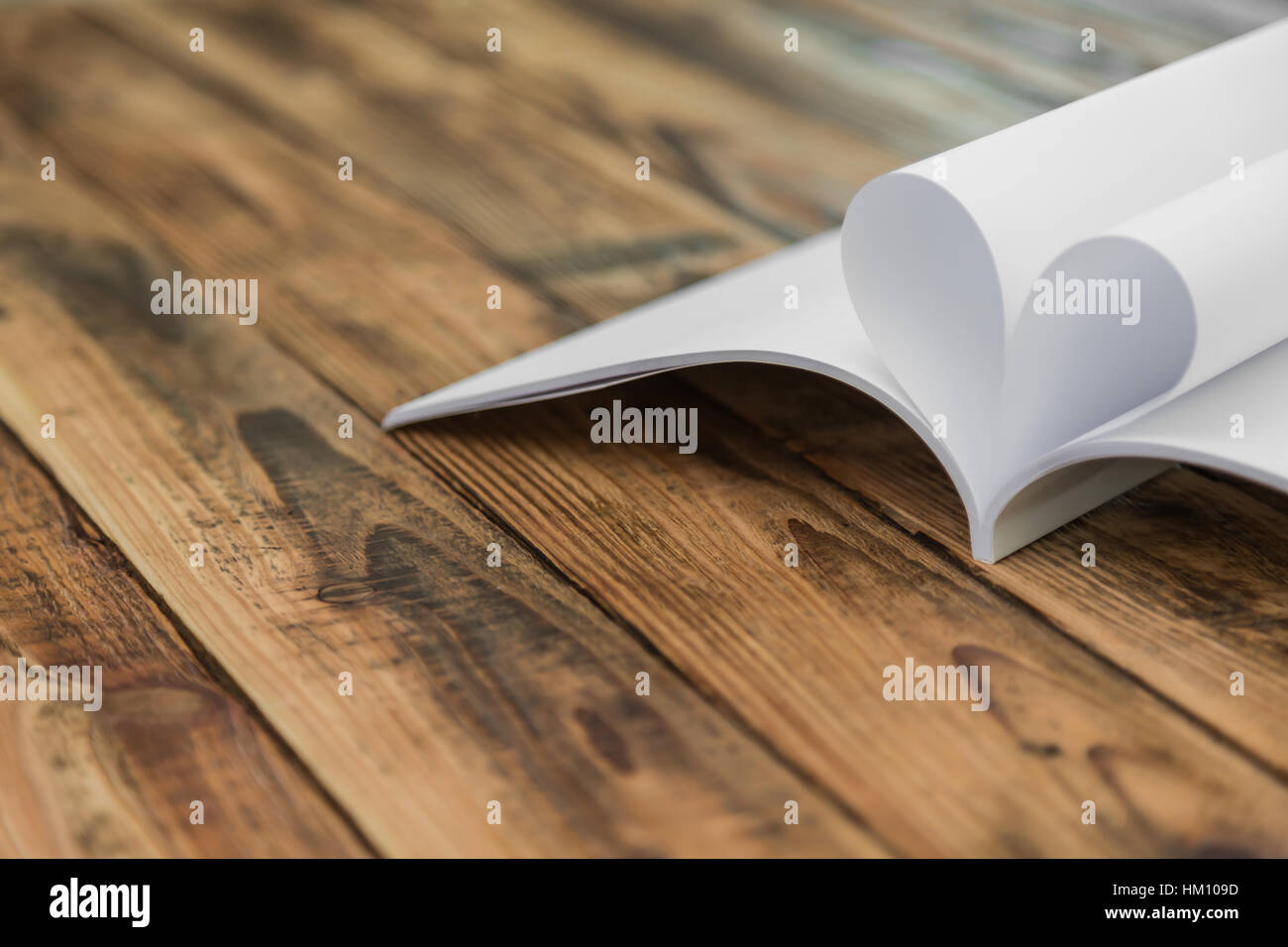 Book with opened pages of shape of heart Stock Photo - Alamy