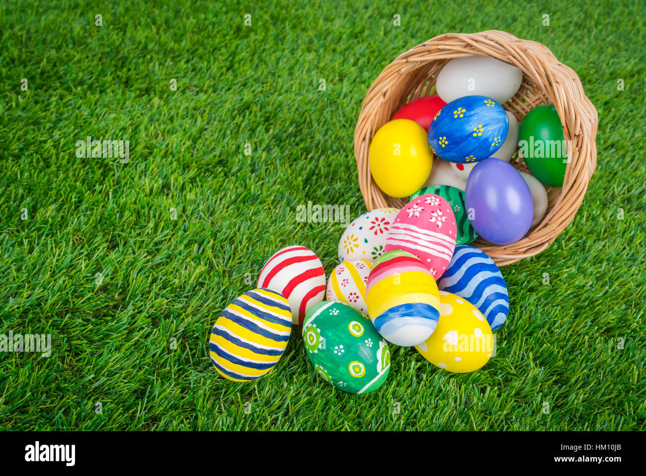 Basket of easter eggs on Fresh Green Grass Stock Photo - Alamy