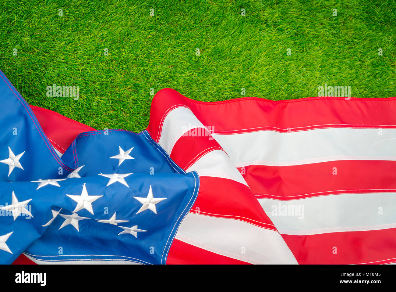 American flag on green grass Stock Photo - Alamy