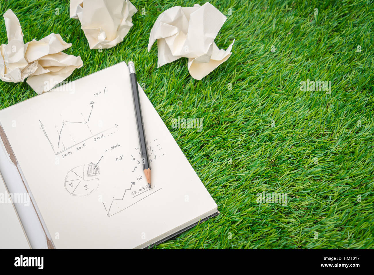 Opened book with business concept and graph Stock Photo - Alamy