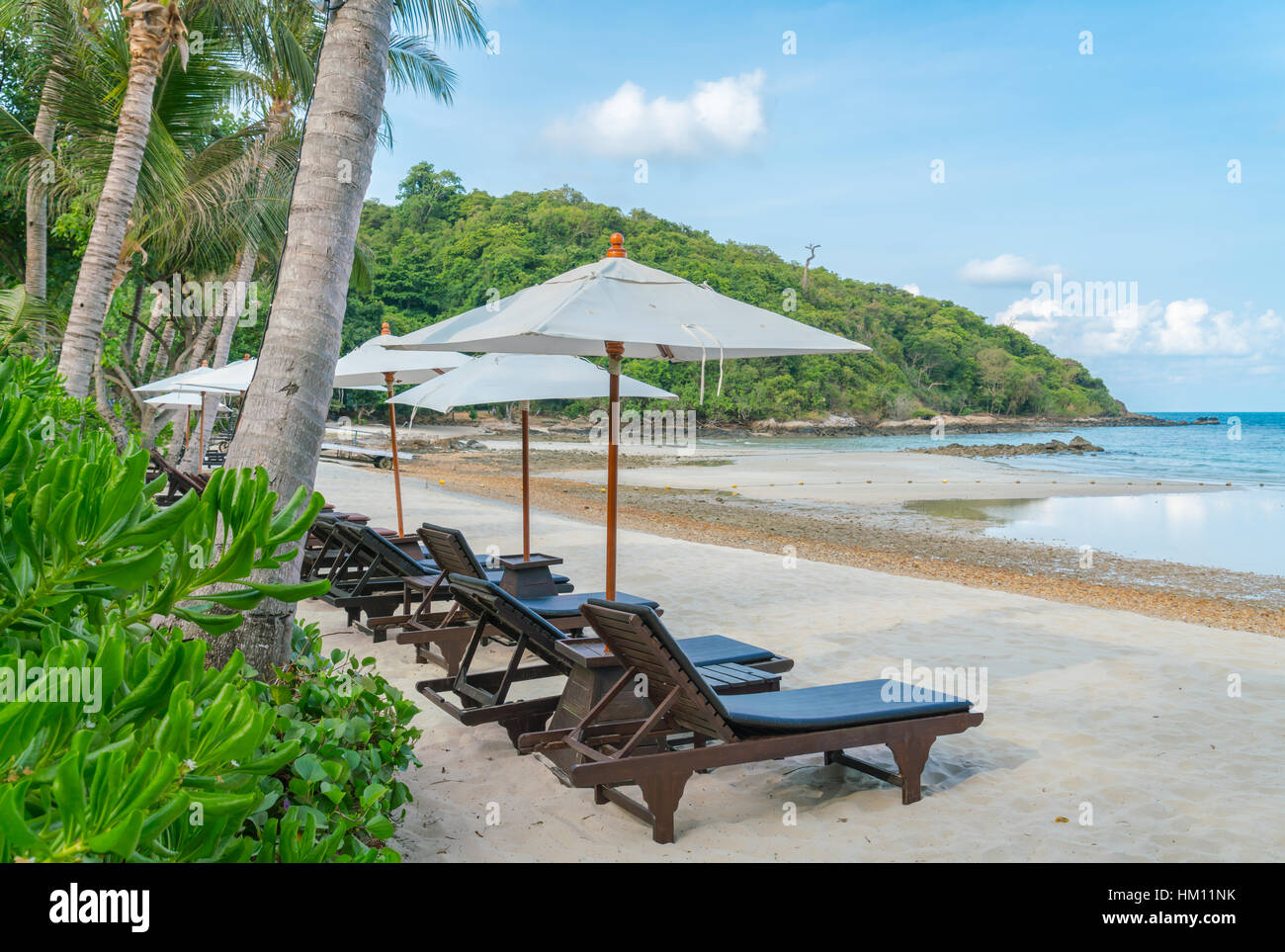 Beautiful beach chairs with umbrella on tropical white sand beach Stock ...
