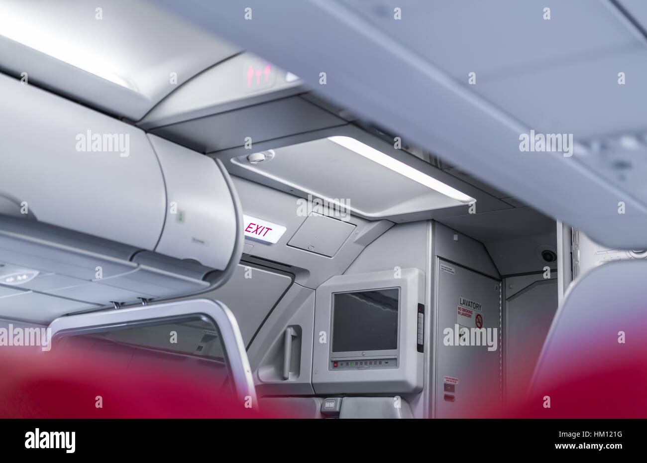 Emergency exit in aircraft Stock Photo - Alamy