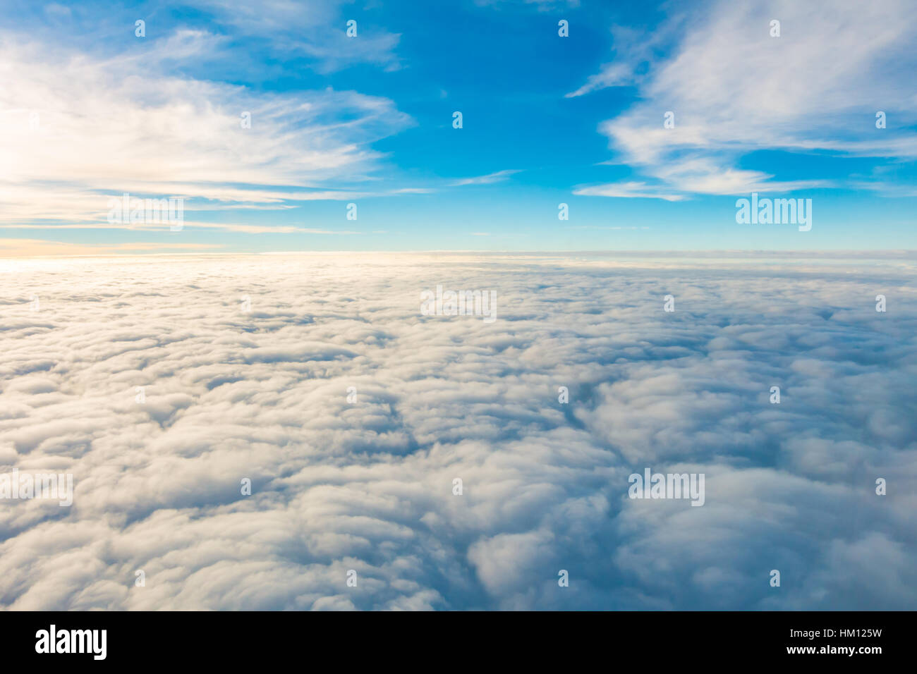 Sunrise above clouds from airplane window Stock Photo - Alamy