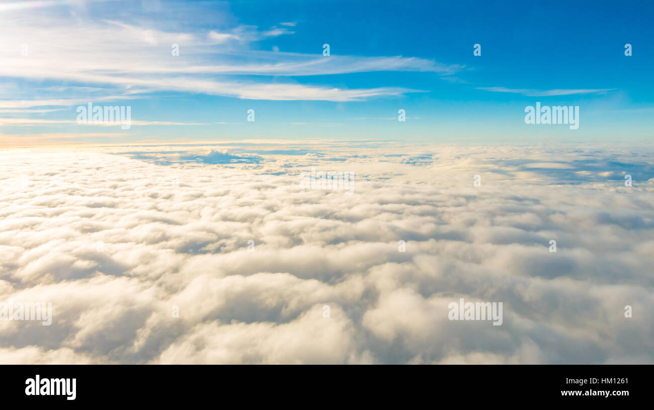 Sunrise above clouds from airplane window Stock Photo - Alamy
