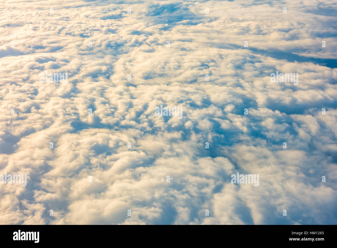 Sunrise above clouds from airplane window Stock Photo - Alamy