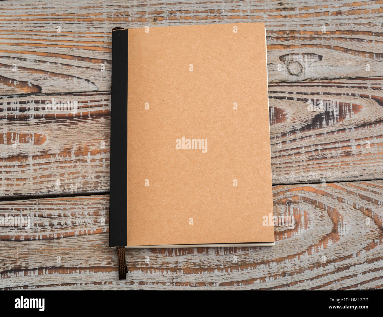 Recycled paper book on wood background Stock Photo - Alamy