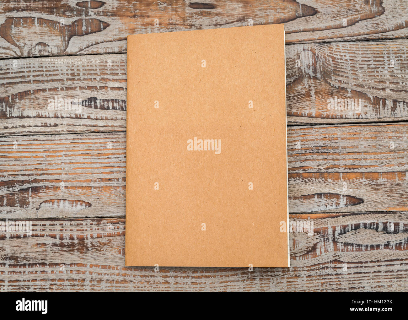 Recycled paper book on wood background Stock Photo - Alamy