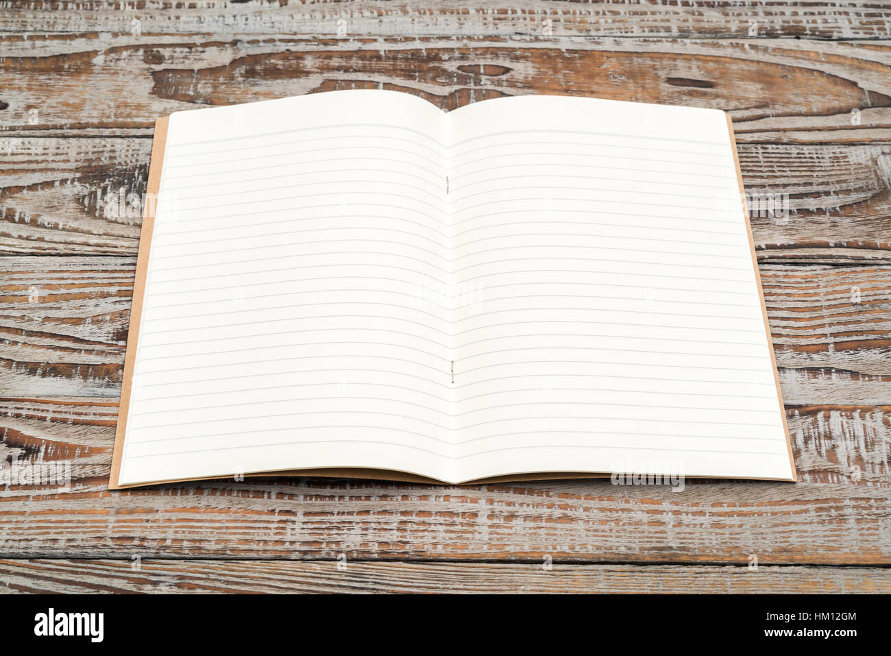 Recycled paper book on wood background Stock Photo - Alamy