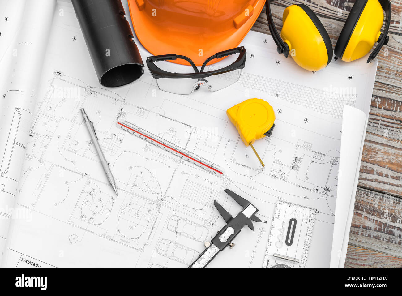 Construction plans with helmet and drawing tools on blueprints Stock ...