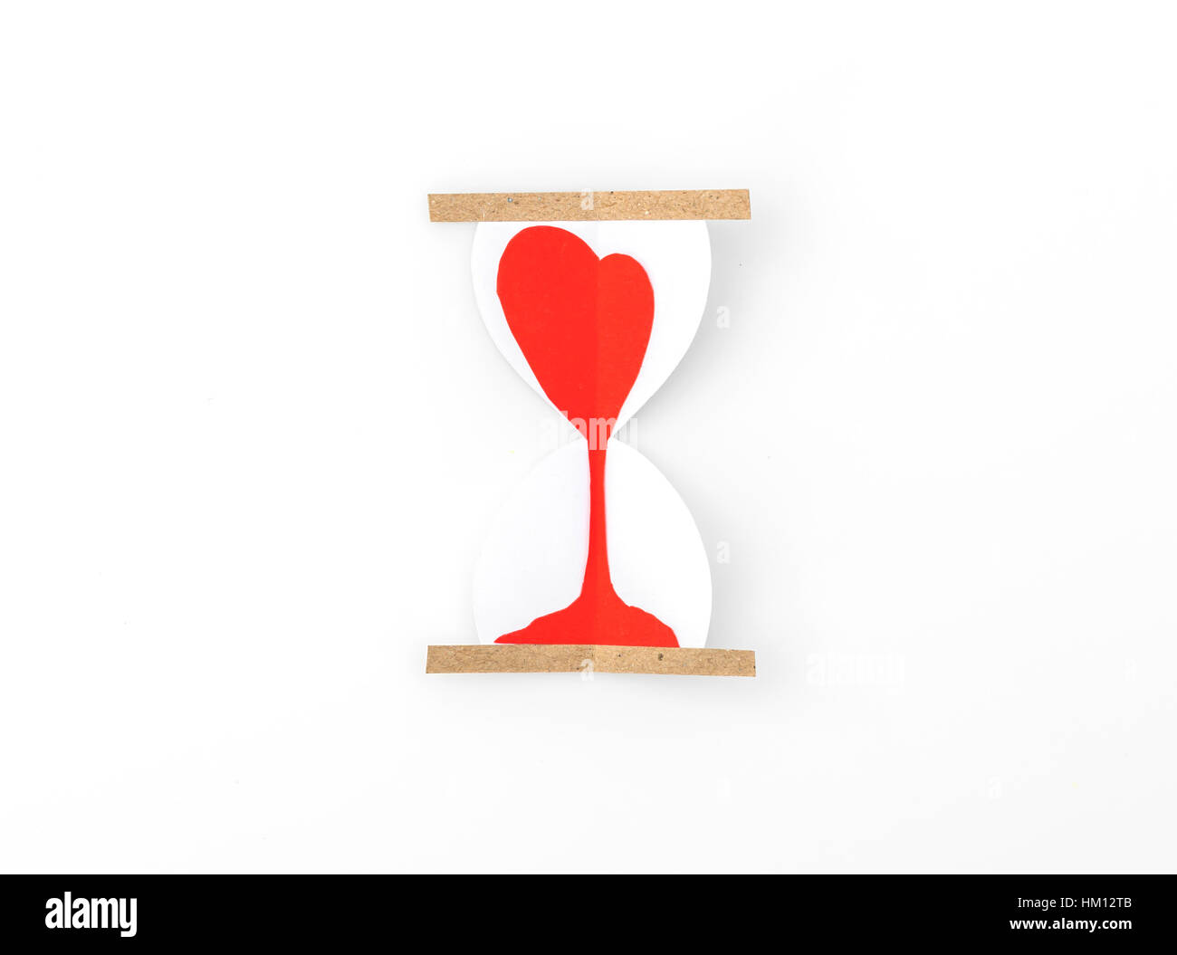 Paper cut of Hearts in Sand Clock Stock Photo - Alamy