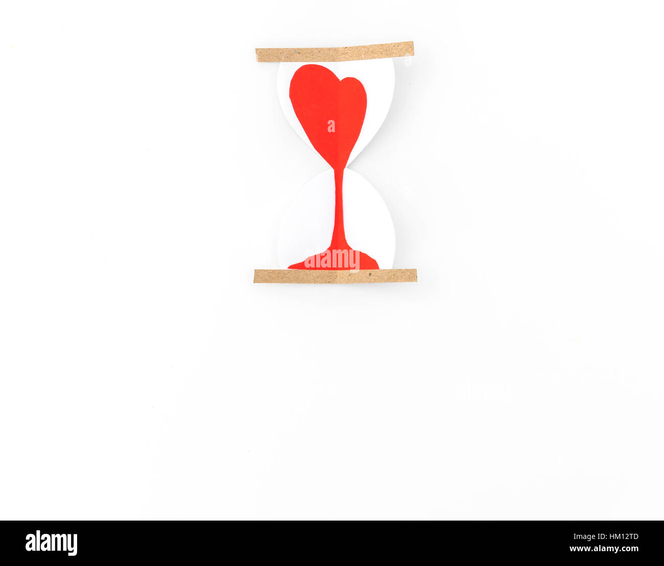 Paper cut of Hearts in Sand Clock Stock Photo - Alamy