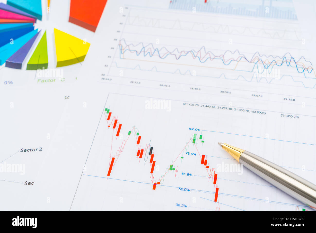 Financial charts with pen Stock Photo - Alamy