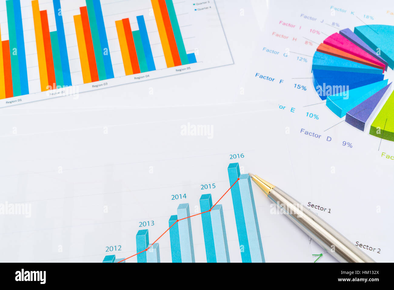 Financial charts with pen Stock Photo - Alamy