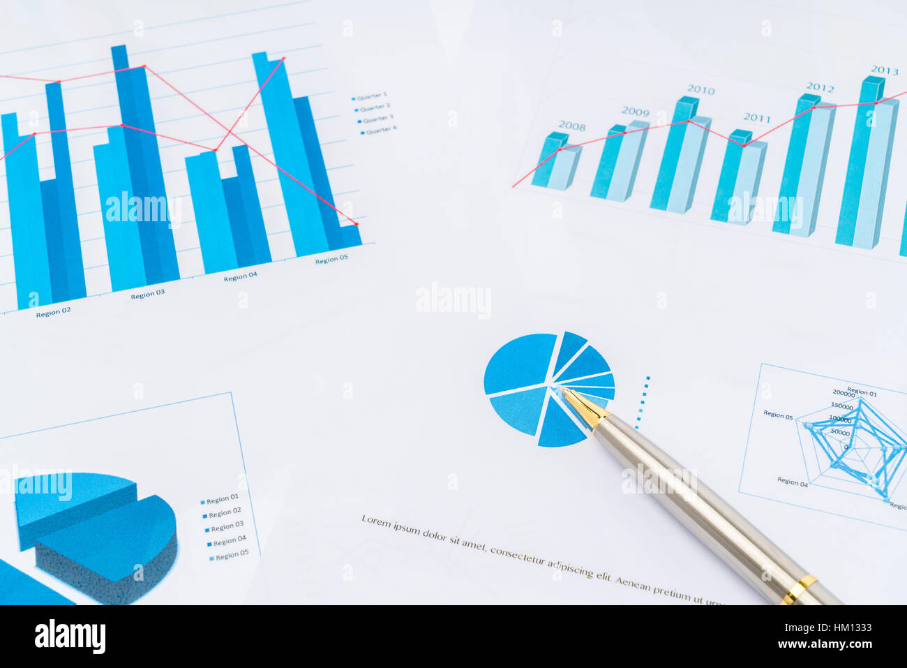 Financial charts with pen Stock Photo - Alamy