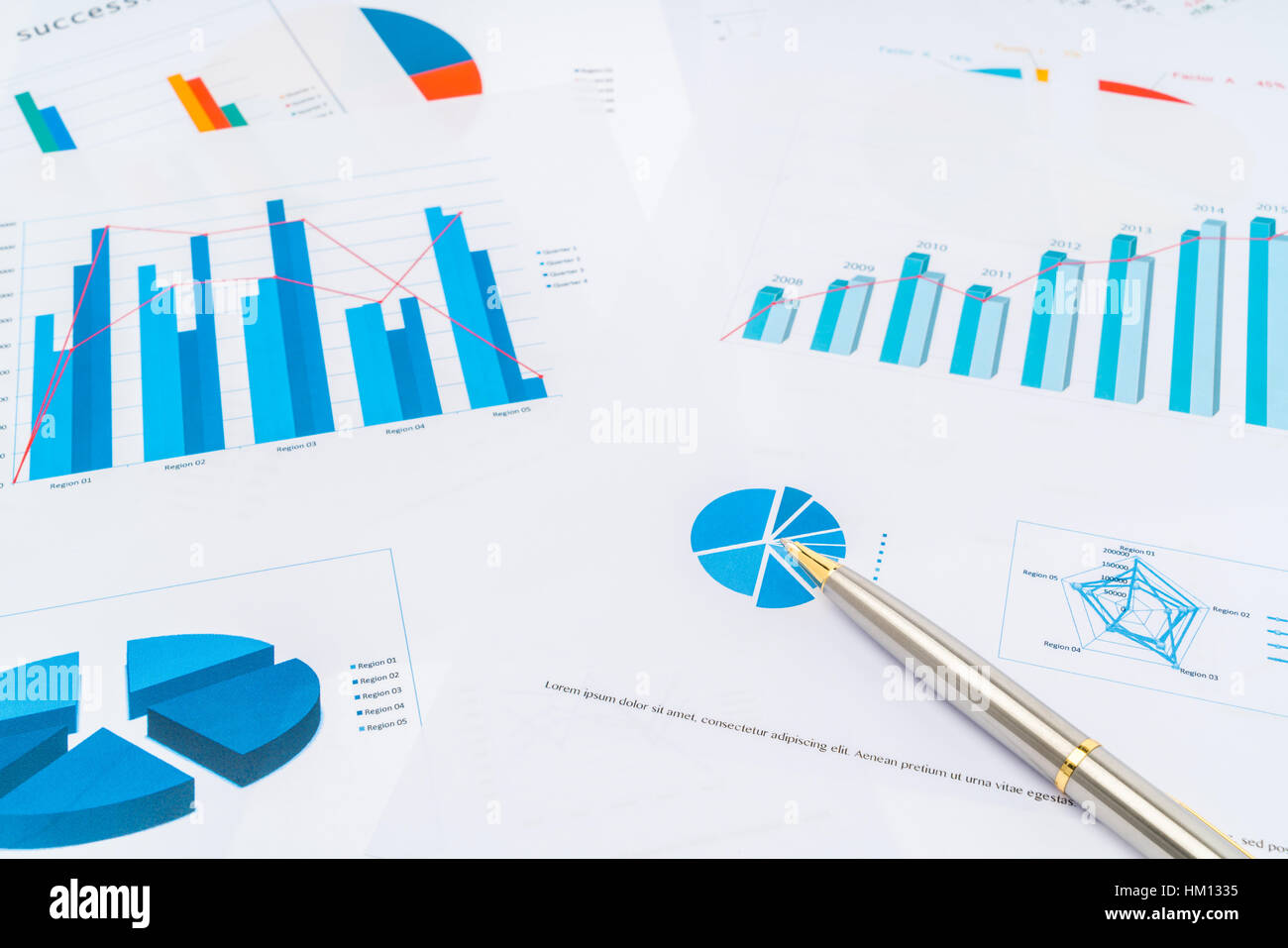 Financial charts with pen Stock Photo - Alamy