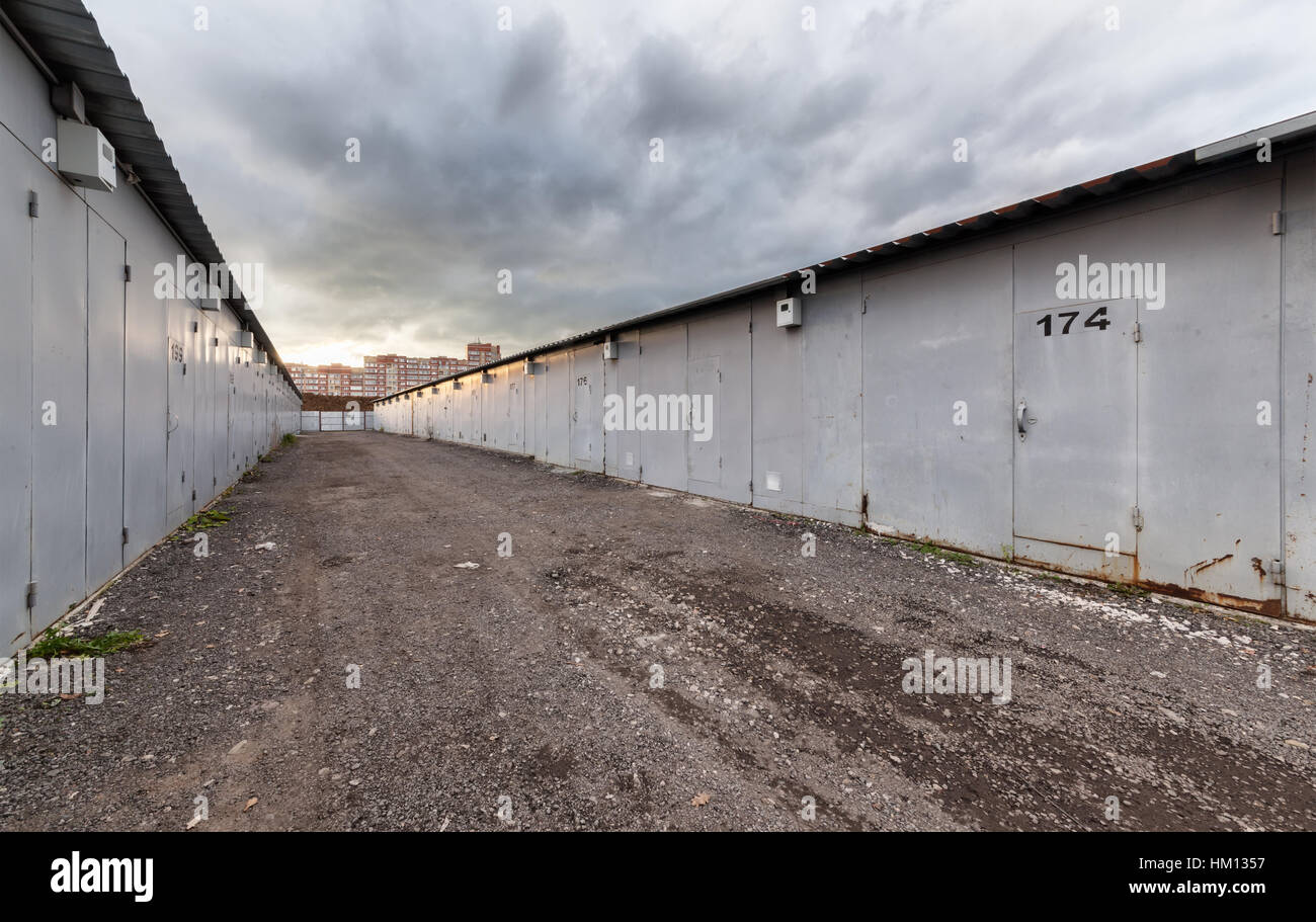Gated garage complex on the background of stormy sky Stock Photo - Alamy