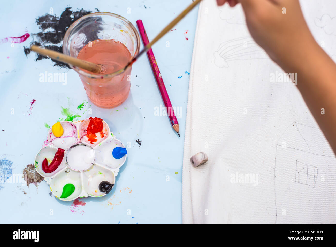 Mixing Water Colors in a painting Class Stock Photo - Alamy