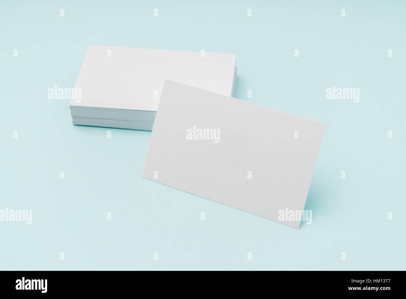 Blank business card on blue background Stock Photo - Alamy