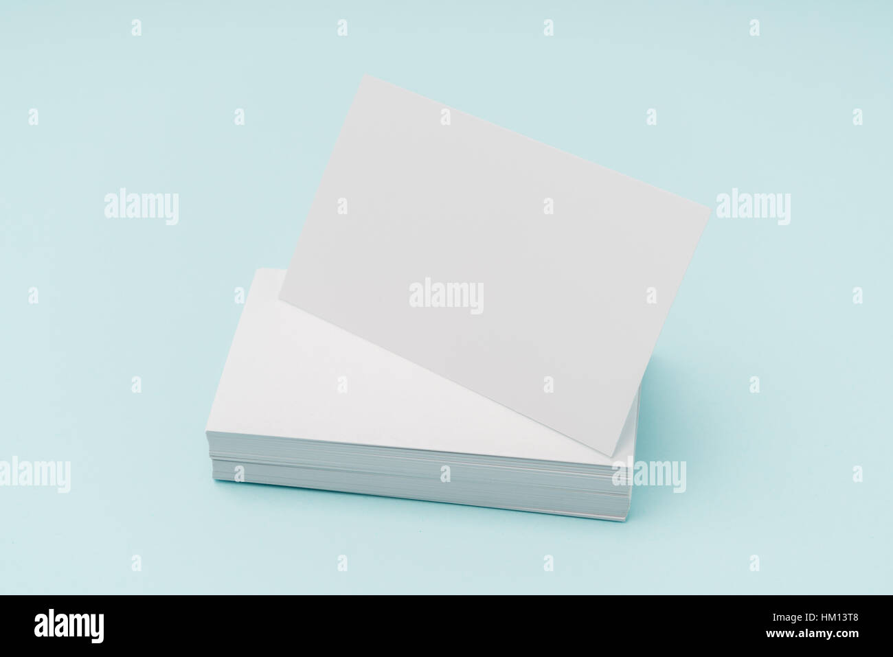 Blank business card on blue background Stock Photo - Alamy