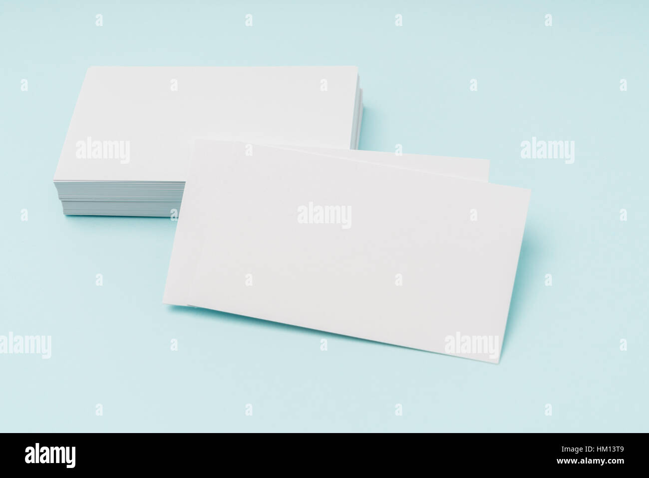 Blank business card on blue background Stock Photo - Alamy