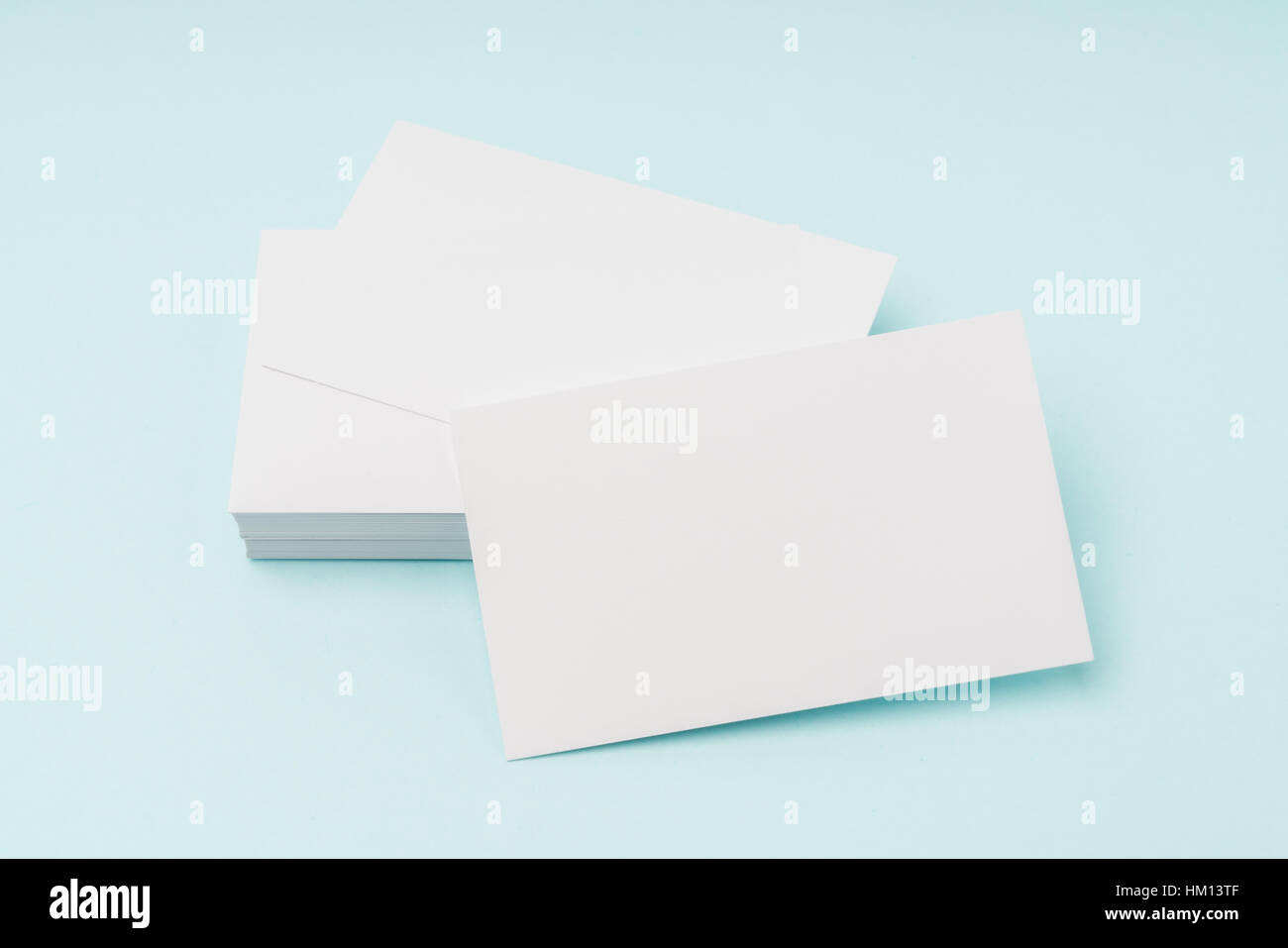 Blank business card on blue background Stock Photo - Alamy