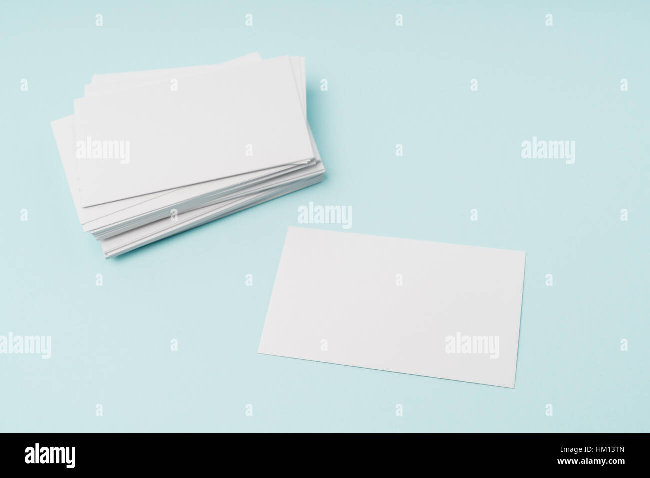 Blank business card on blue background Stock Photo - Alamy