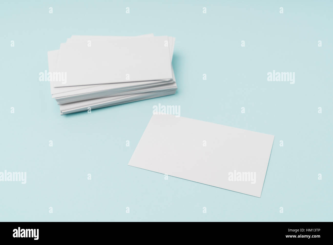 Blank business card on blue background Stock Photo - Alamy