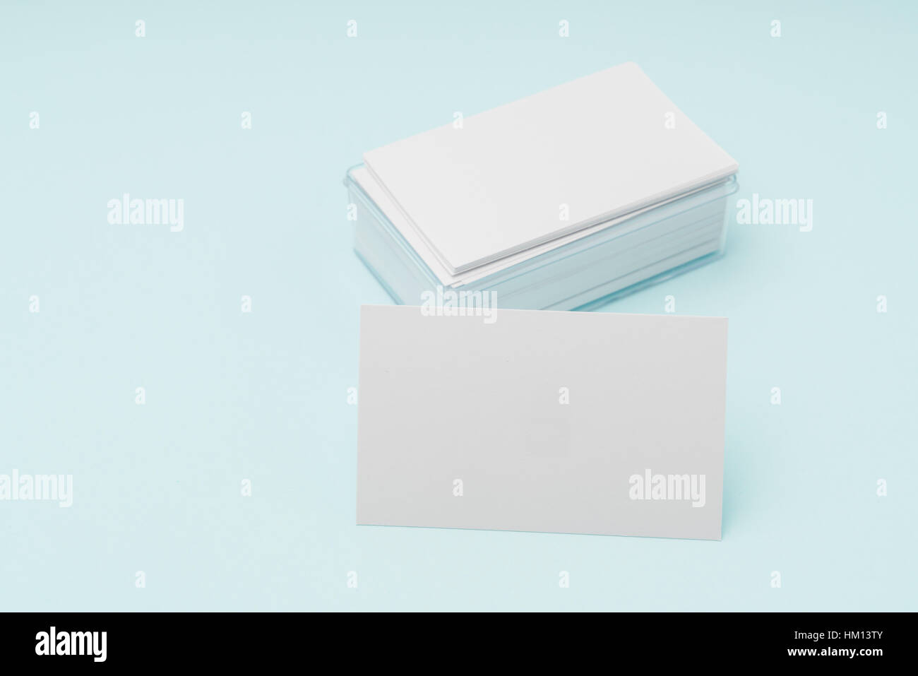 Blank business card on blue background Stock Photo - Alamy