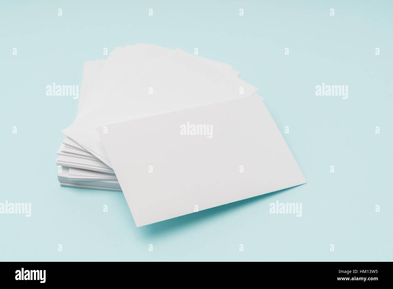 Blank business card on blue background Stock Photo - Alamy