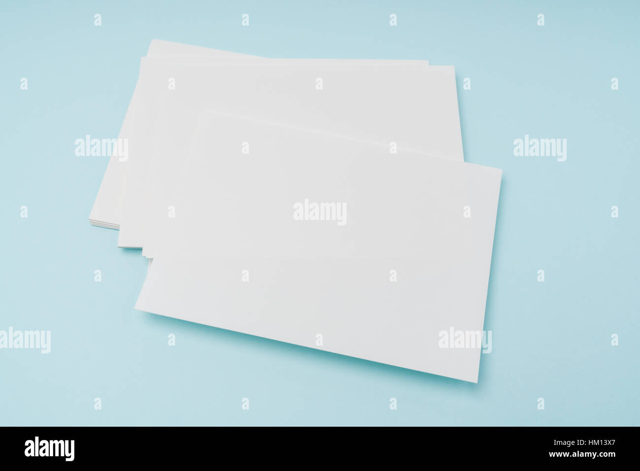 Blank business card on blue background Stock Photo - Alamy
