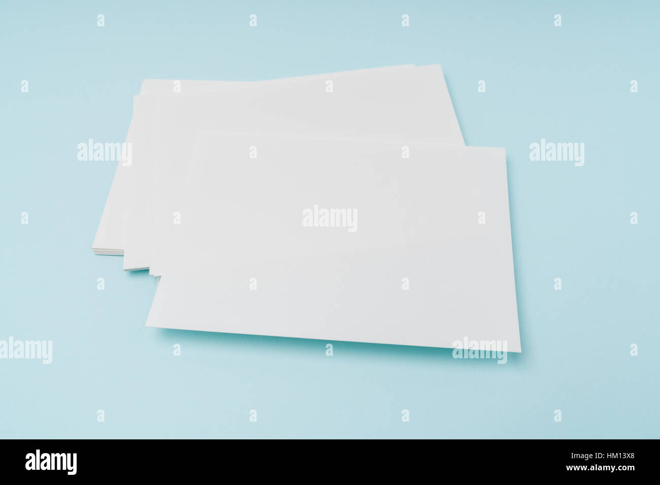 Blank business card on blue background Stock Photo - Alamy
