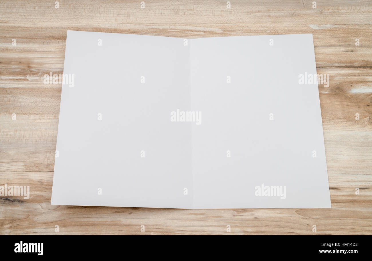 Bifold white template paper on wood texture Stock Photo - Alamy