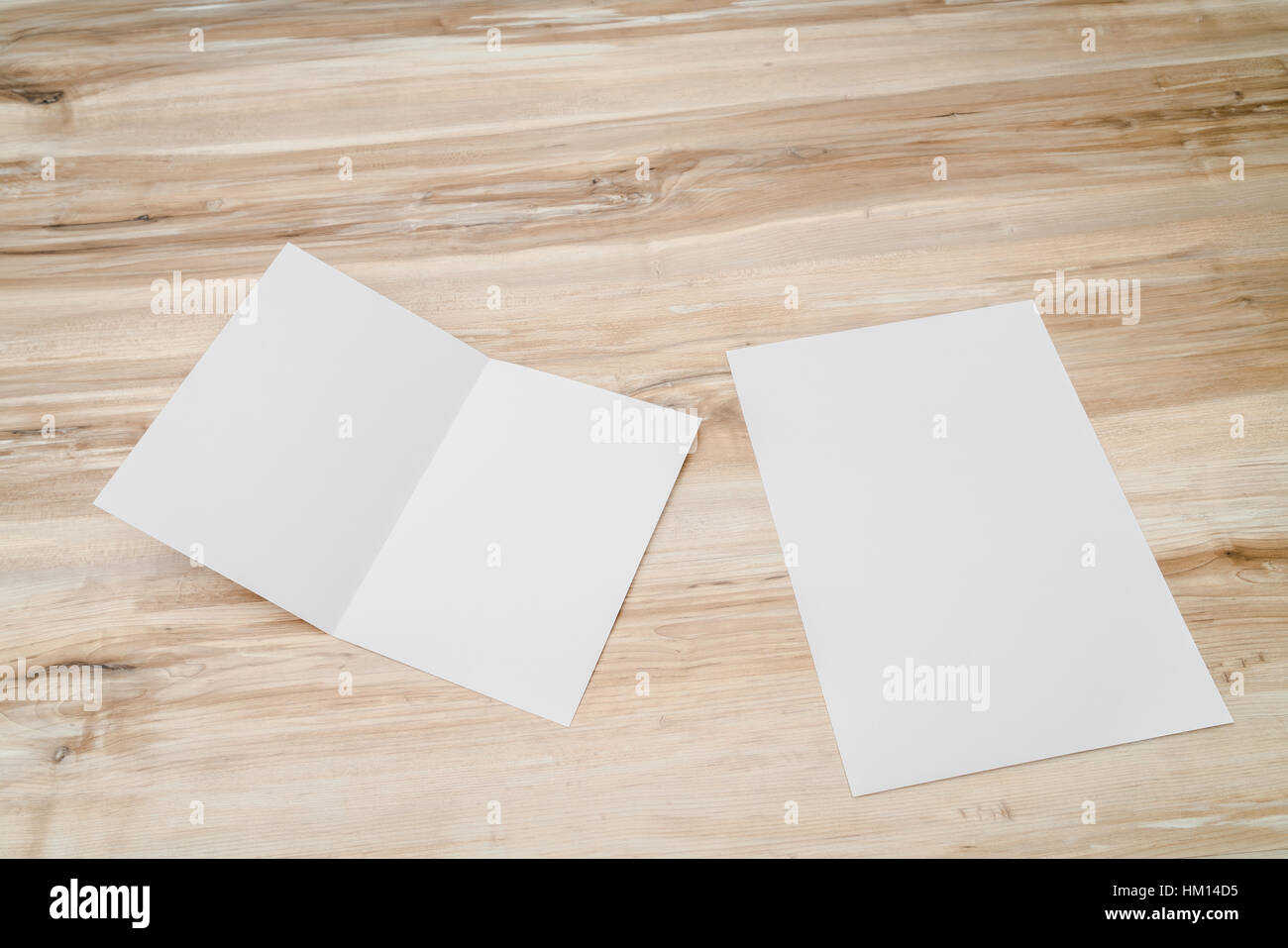 Bifold white template paper on wood texture Stock Photo - Alamy