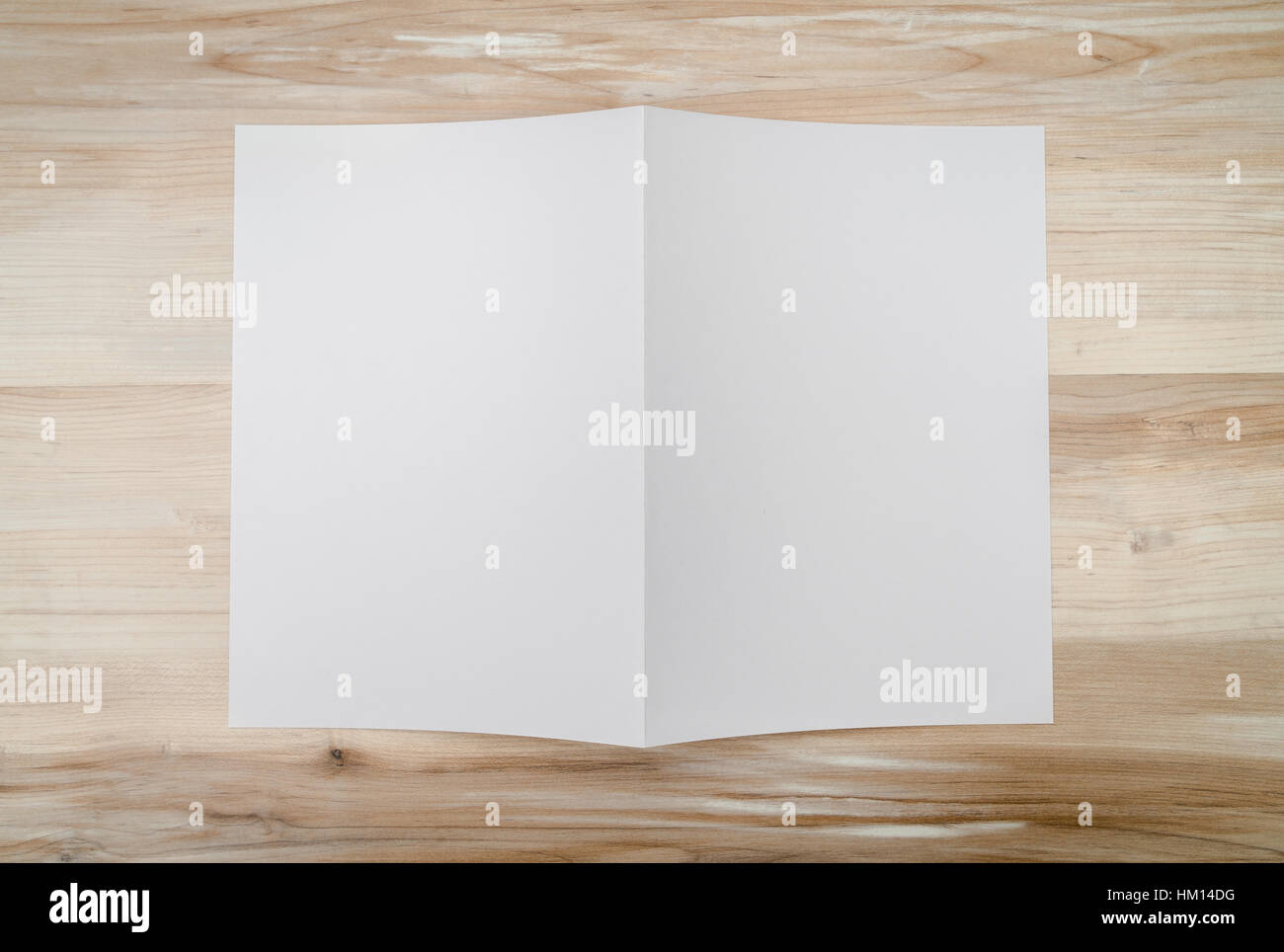 Bifold white template paper on wood texture Stock Photo - Alamy