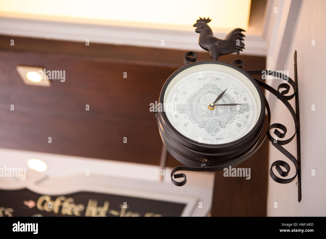Old style hanging clock Stock Photo - Alamy