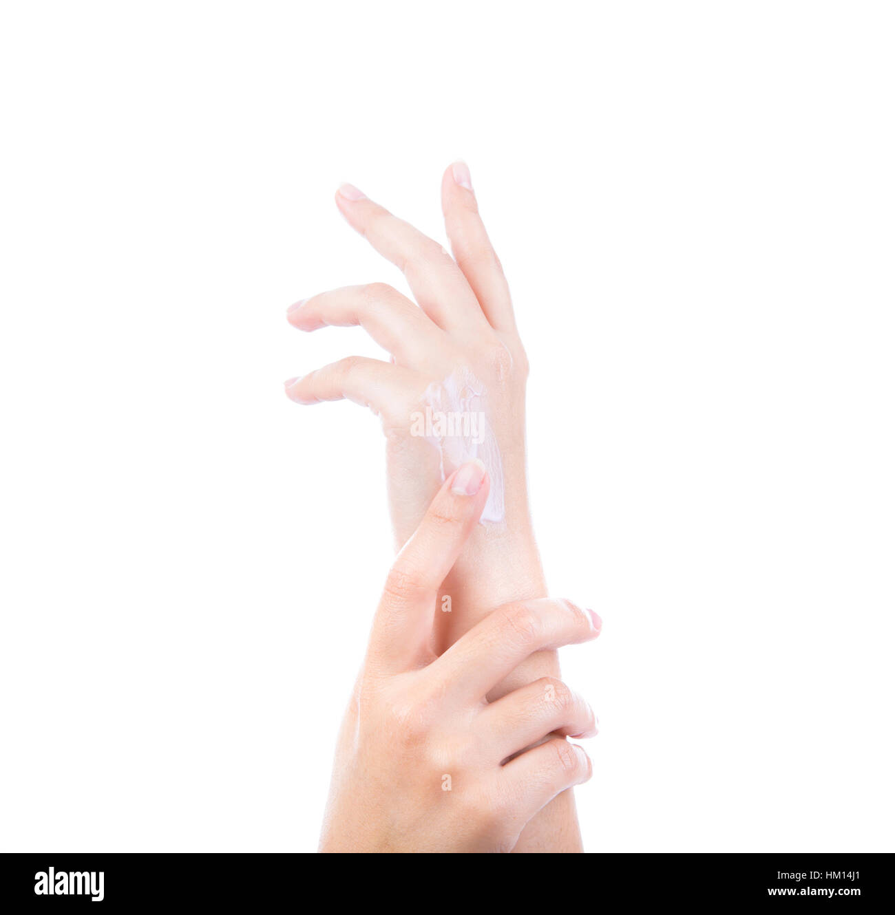 Closeup of beautiful woman hands applying hand cream isolated on white ...