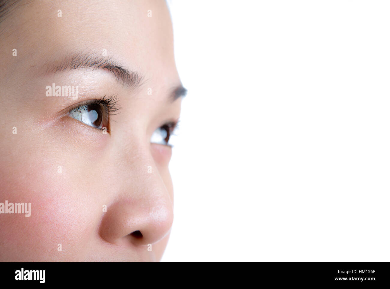 Close-up portrait of a beautiful eye Looking up isolate on white ...