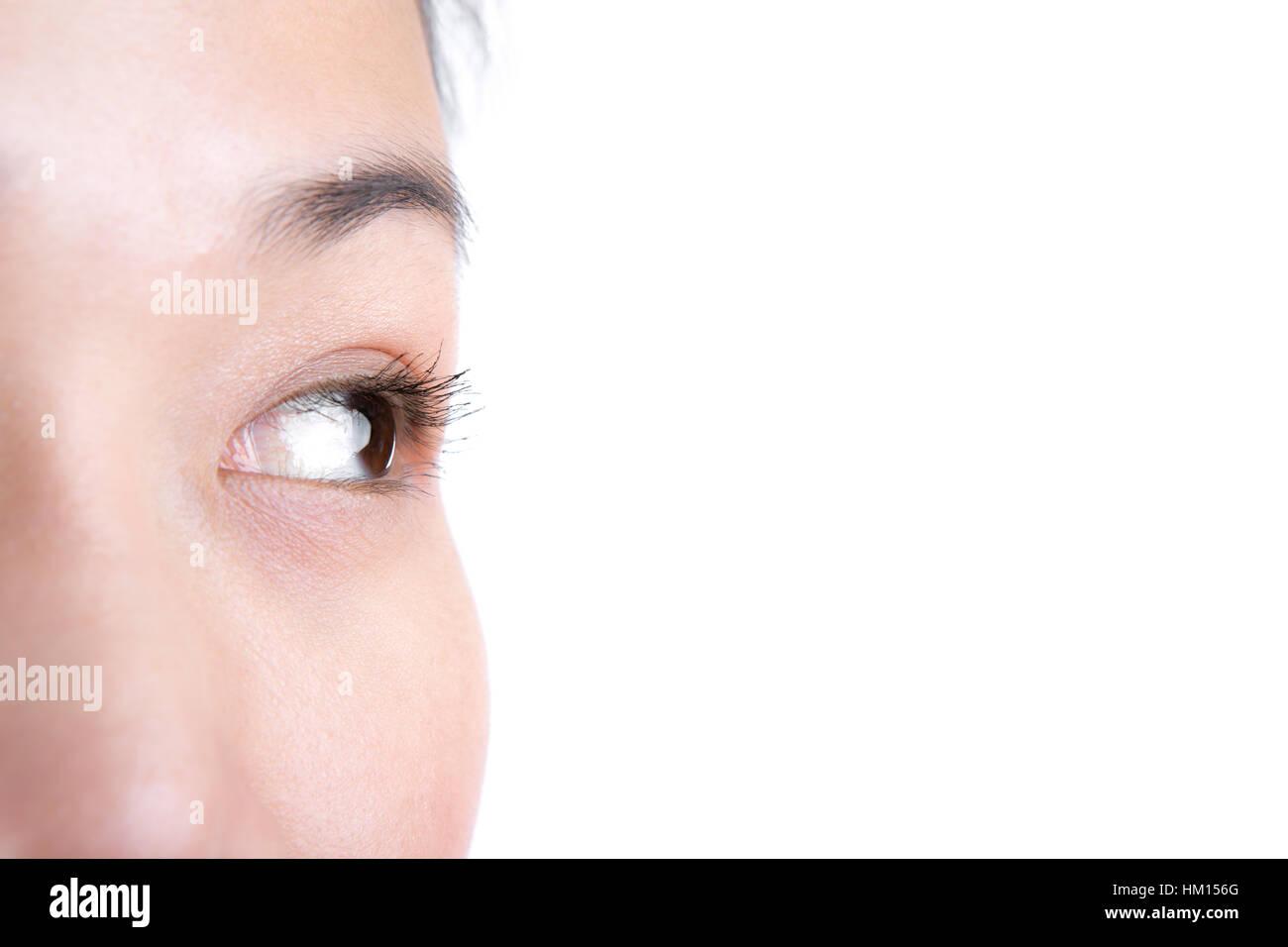Close-up portrait of a beautiful eye Looking up isolate on white ...