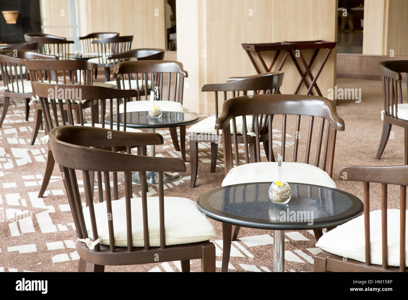 Interior of modern restaurant with the covered tables Stock Photo - Alamy